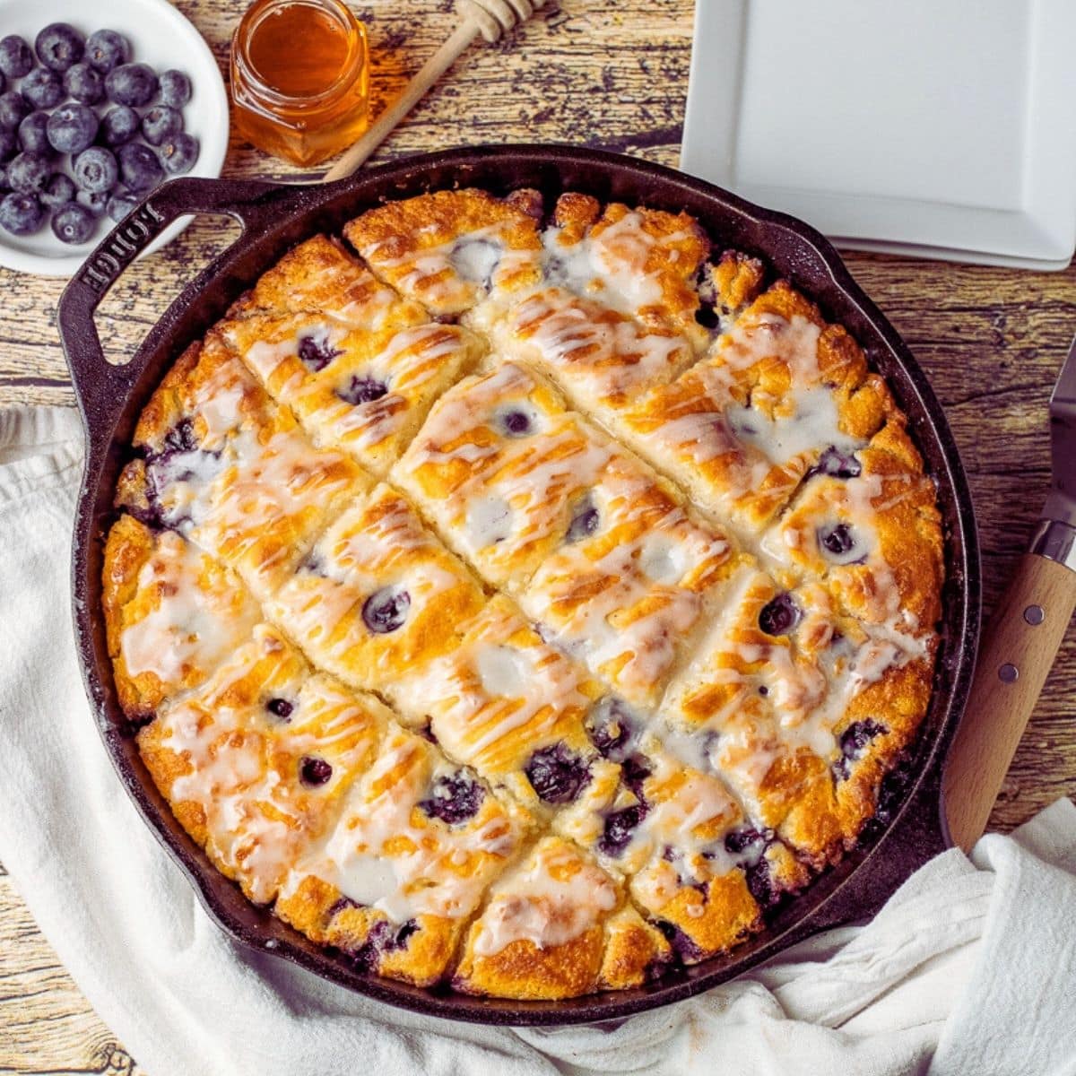 Blueberry Butter Swim Biscuits in a Cast Iron Skillet - Feeding Your Fam